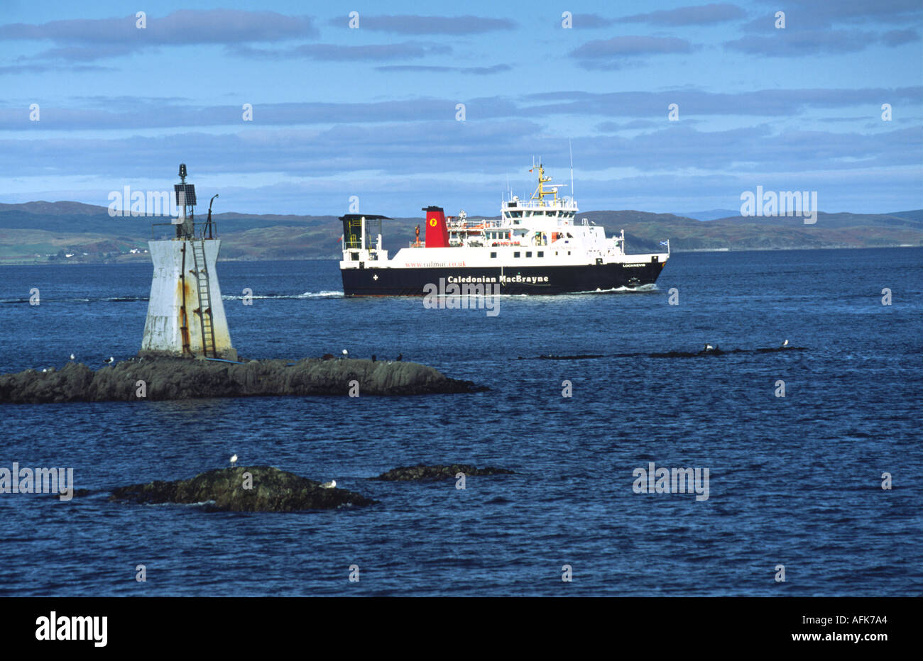 Motor vessel Loch Nevis at Mallaig harbour entrance Scotland with light ...