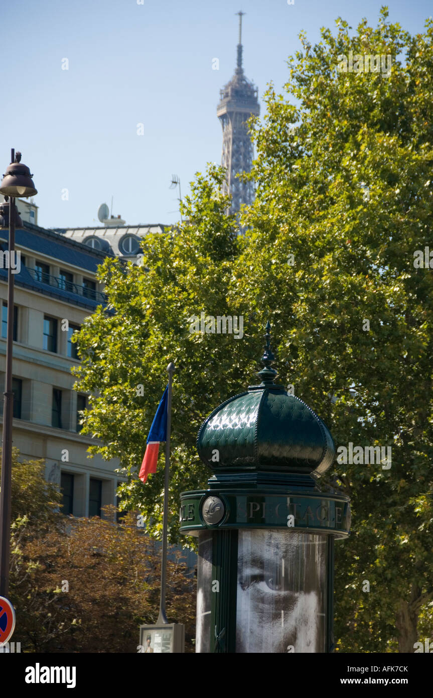 advertising sign and eiffel tower paris france Stock Photo - Alamy