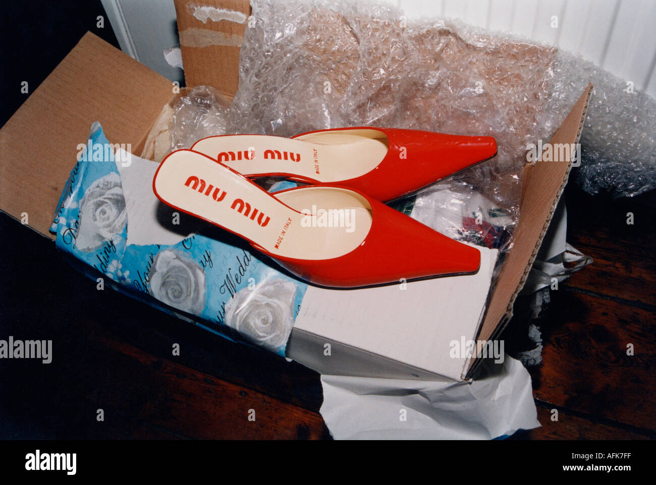 red shiny Mui Mui patent leather slip on shoes Stock Photo - Alamy