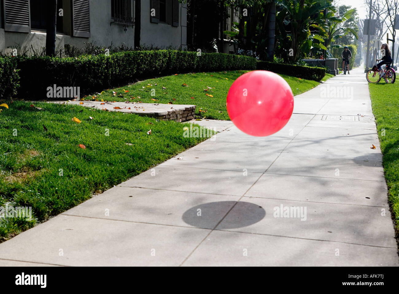 Balloon floating over a walkway Stock Photo - Alamy