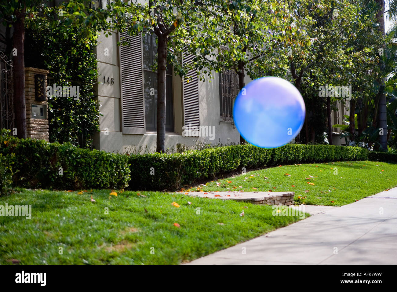 Balloon floating over a walkway Stock Photo - Alamy