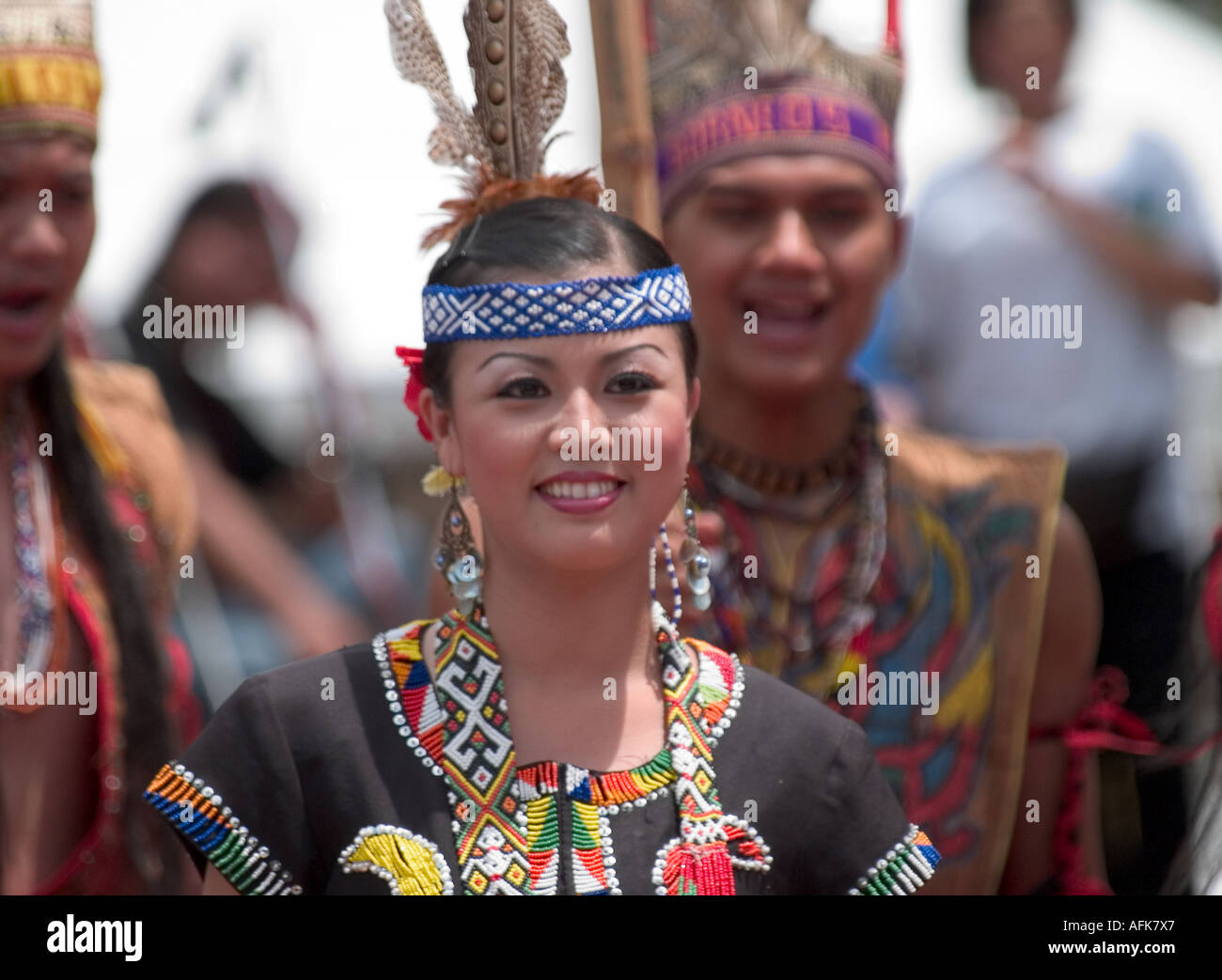 Woman tourist with local man in traditional dress hi-res stock ...