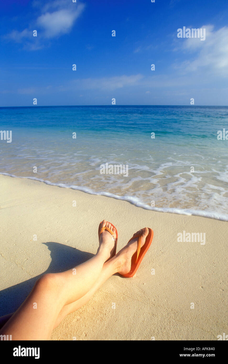 Womans legs on beach near waters edge Key West Florida Model Released ...