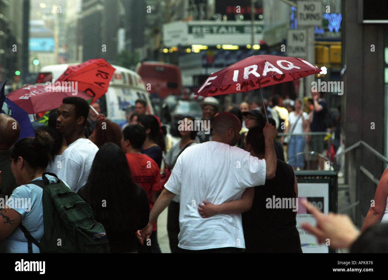 An umbrella protest aagainst the Iraq war takes place in Times Square ...