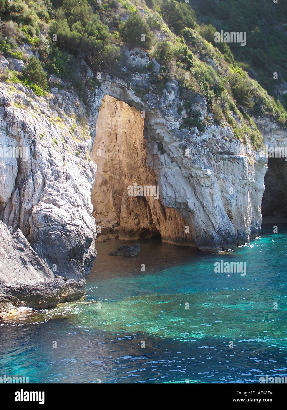 Coastal cave in the greek islands Stock Photo - Alamy