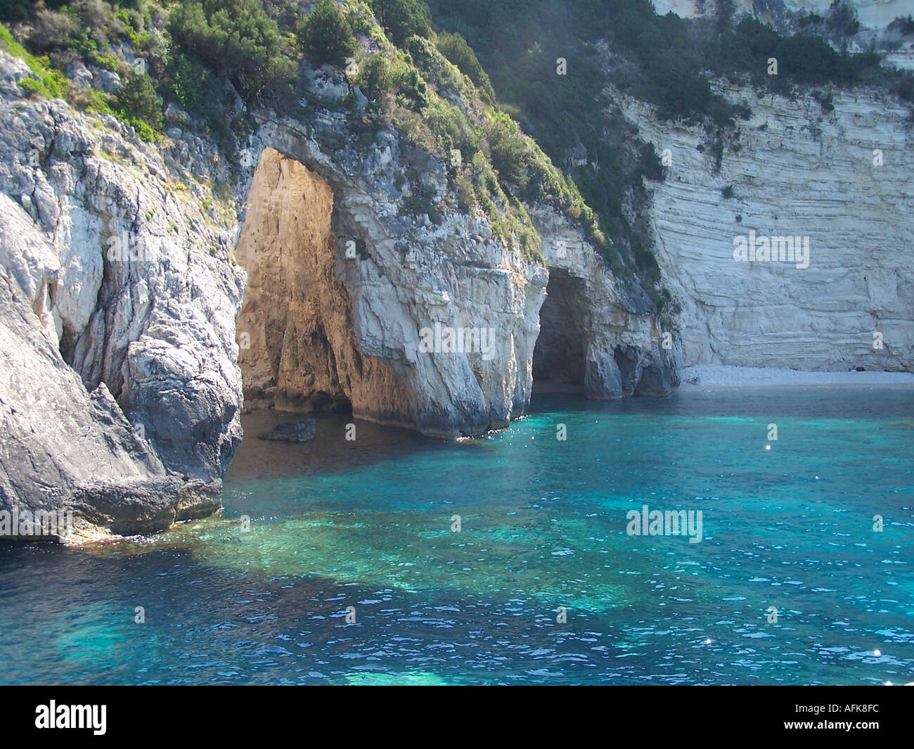 Coastal cave in the greek islands Stock Photo - Alamy