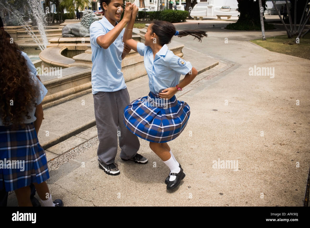 School children dancing salsa in center plaza Stock Photo - Alamy