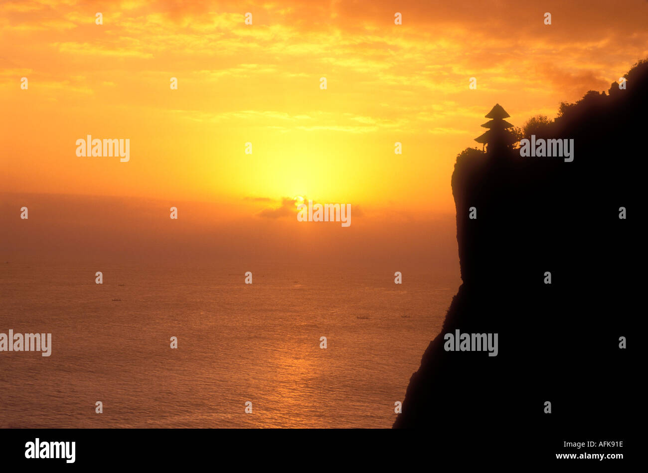 Sunset at Uluwatu Hindu temple on the island of Bali in Indonesia ...
