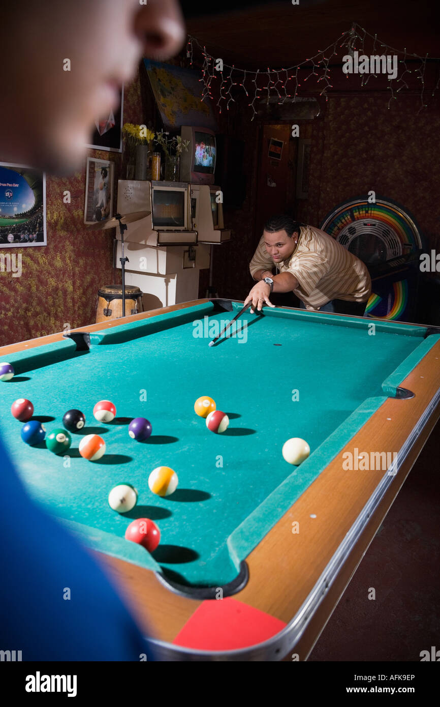 Young men playing pool Stock Photo - Alamy