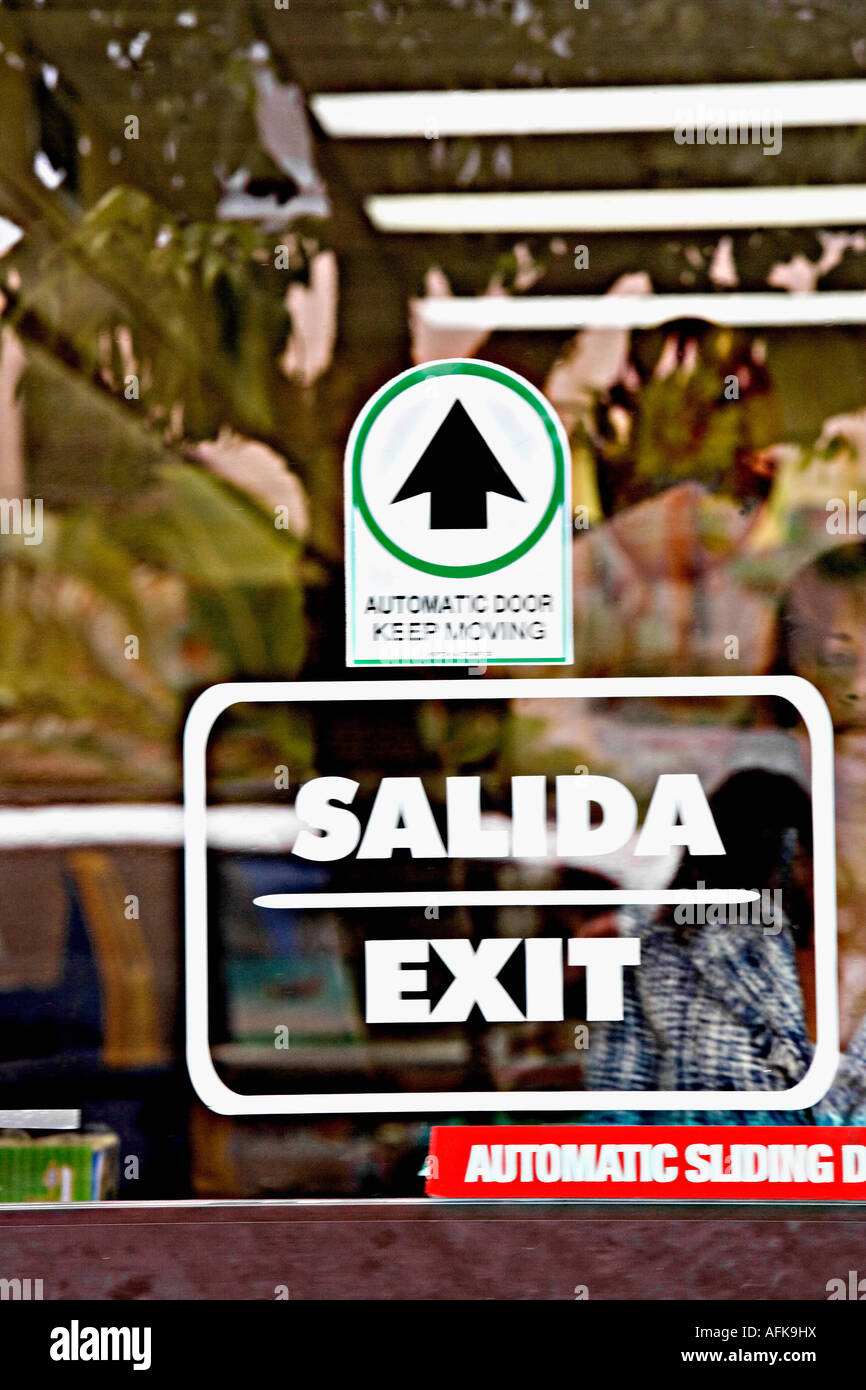 Exit sign, bilingual Stock Photo - Alamy