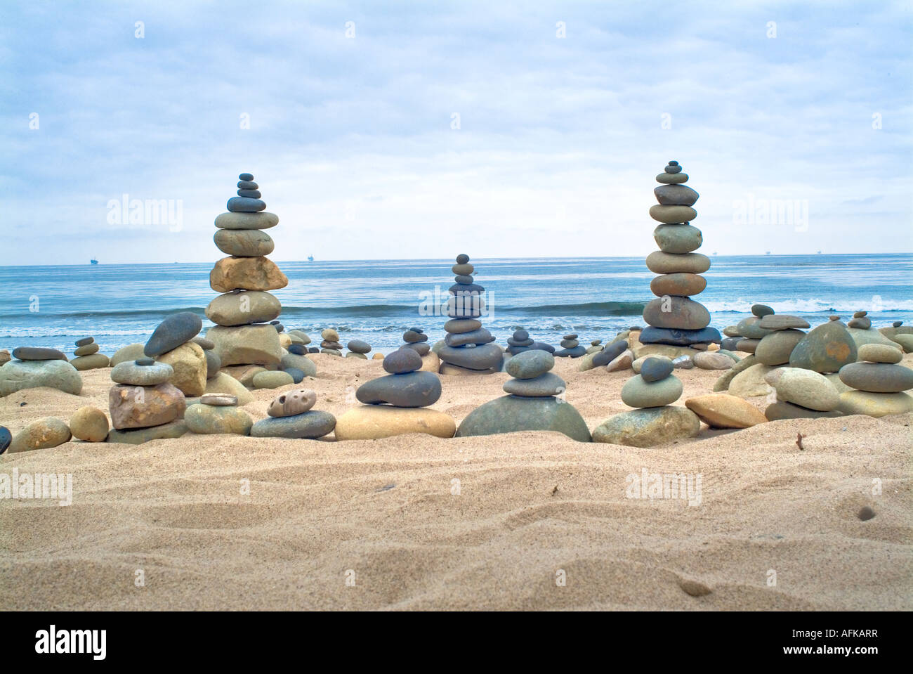 Stack of rocks balanced on beach Stock Photo - Alamy