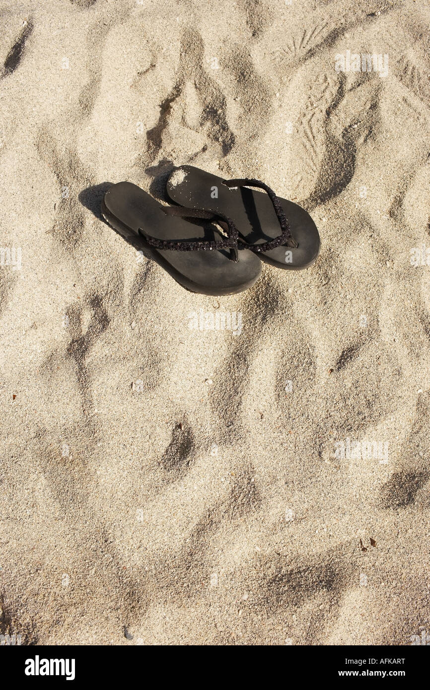 Flip flops on sand Stock Photo - Alamy