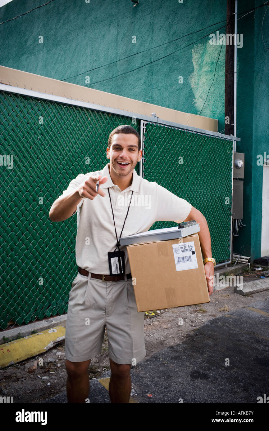Delivery man making deliveries Stock Photo - Alamy