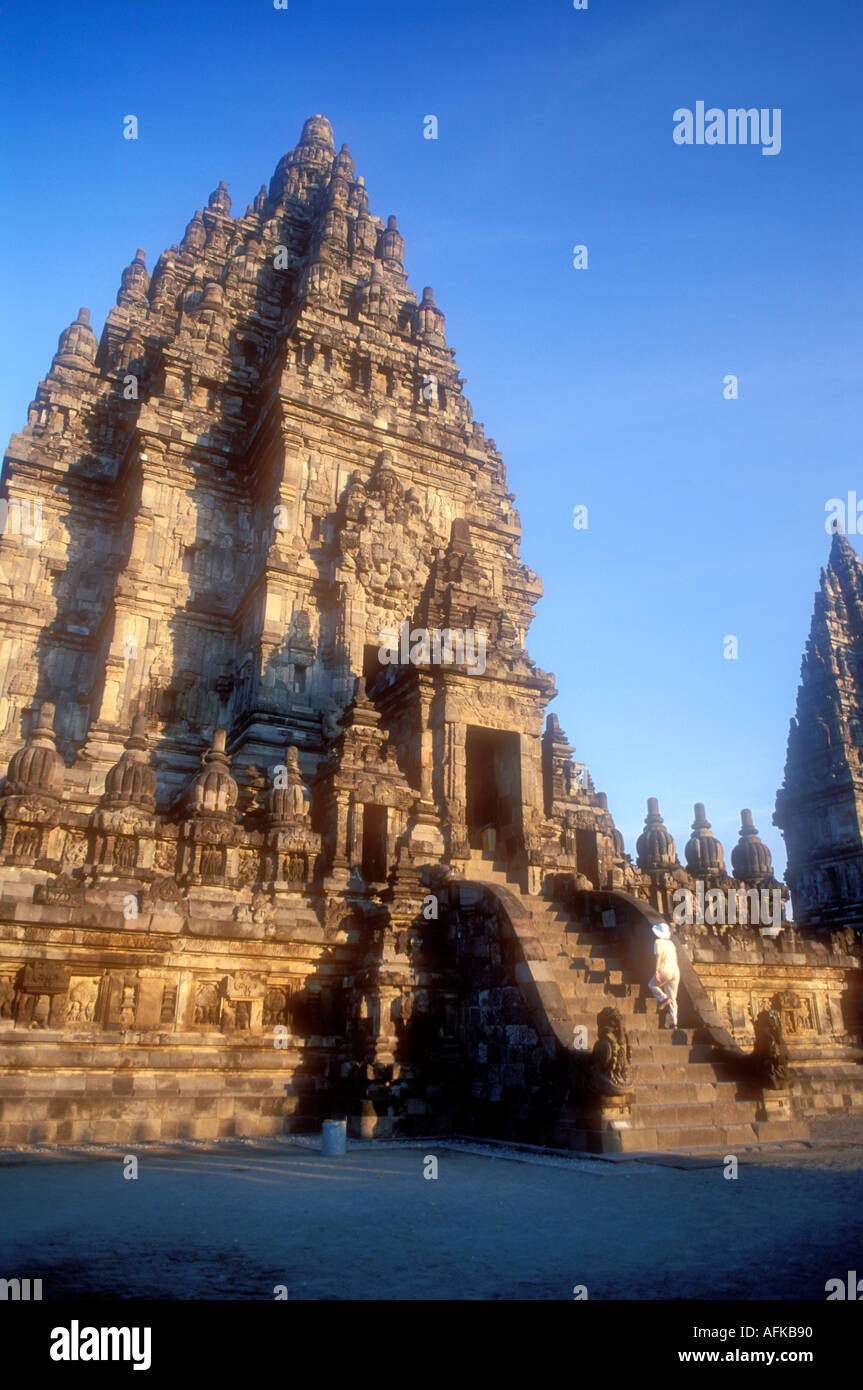 Woman walking up stairs of temple at the Prambanan Hindu temple site in ...