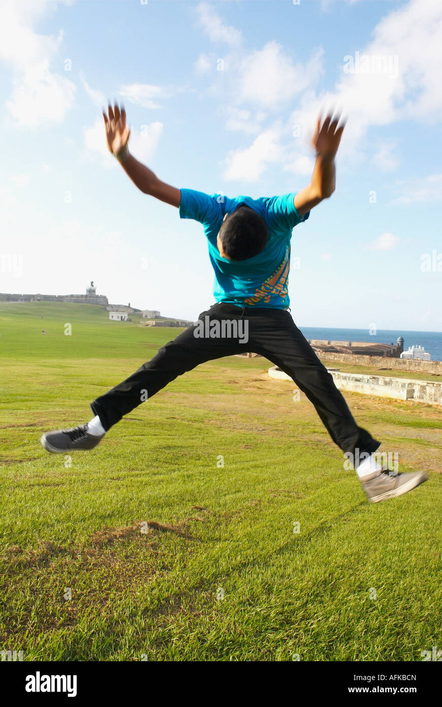 Young man jumping Stock Photo - Alamy