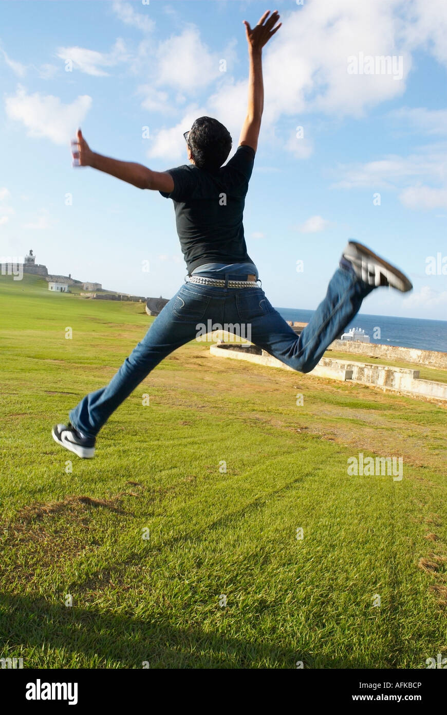 Young man jumping Stock Photo - Alamy