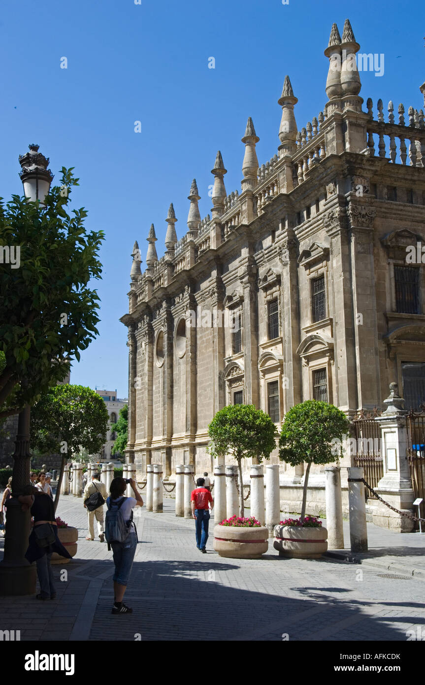 A tourist photographs the magnificent Baroque architecture of Seville's ...
