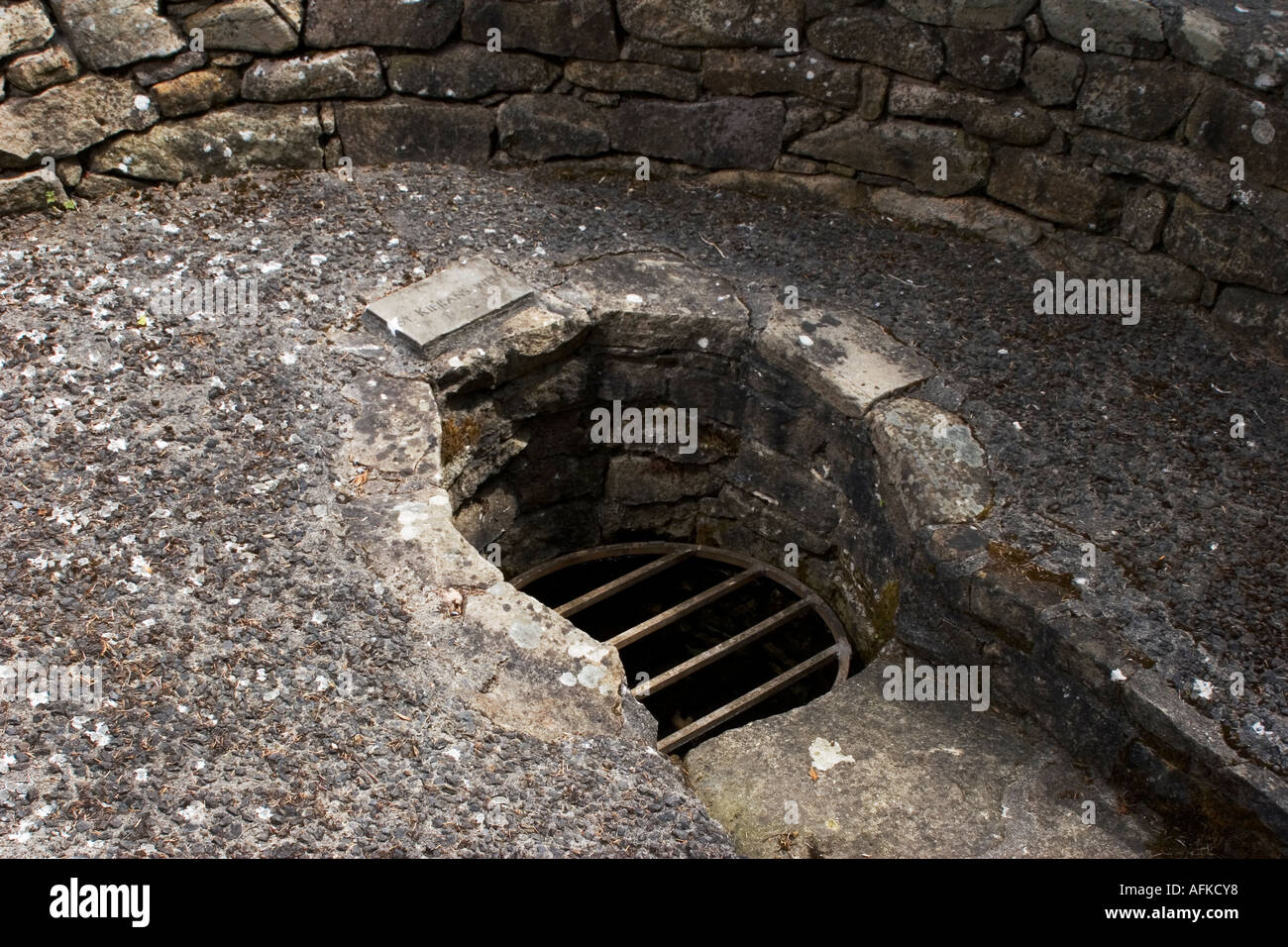 Holy well with water for curing headaches in grounds of old monastery ...