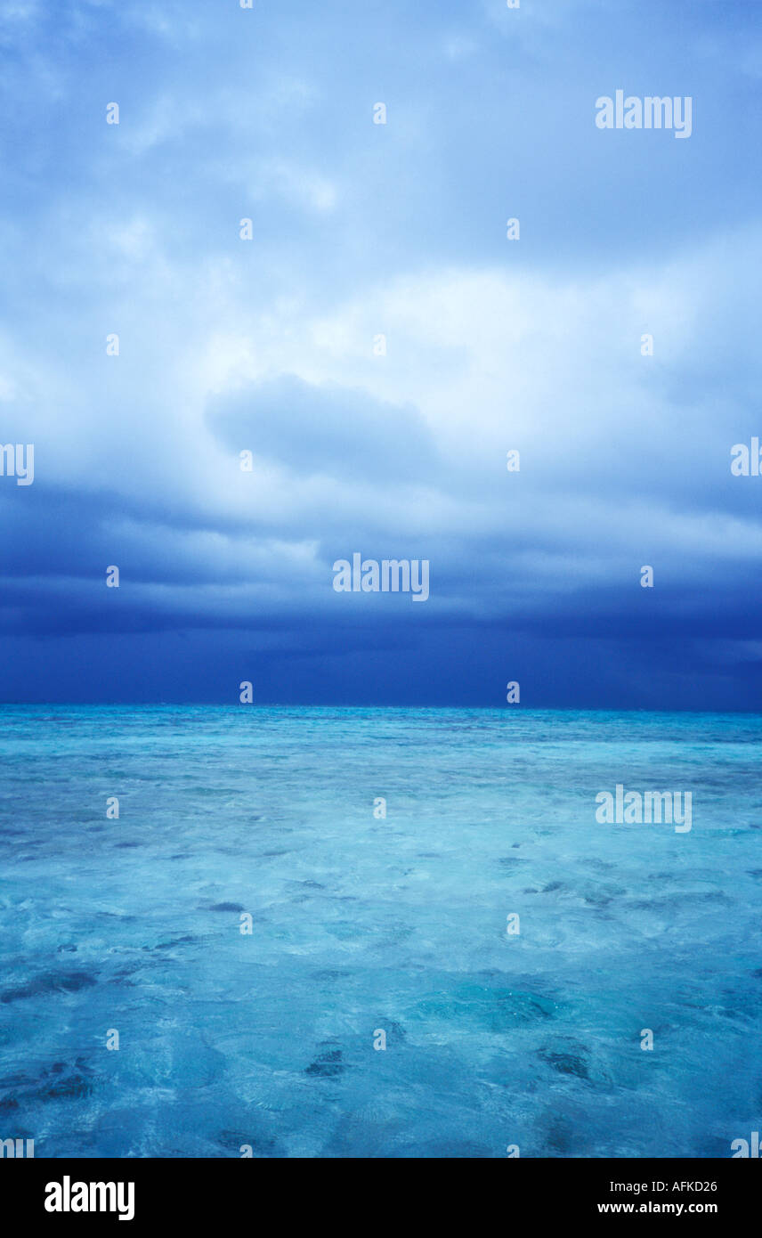 Storm over the ocean horizon in Belize Caribbean Stock Photo - Alamy