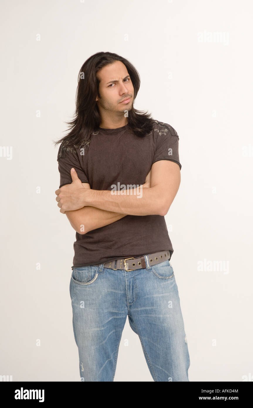 Young man, arms crossed Stock Photo - Alamy