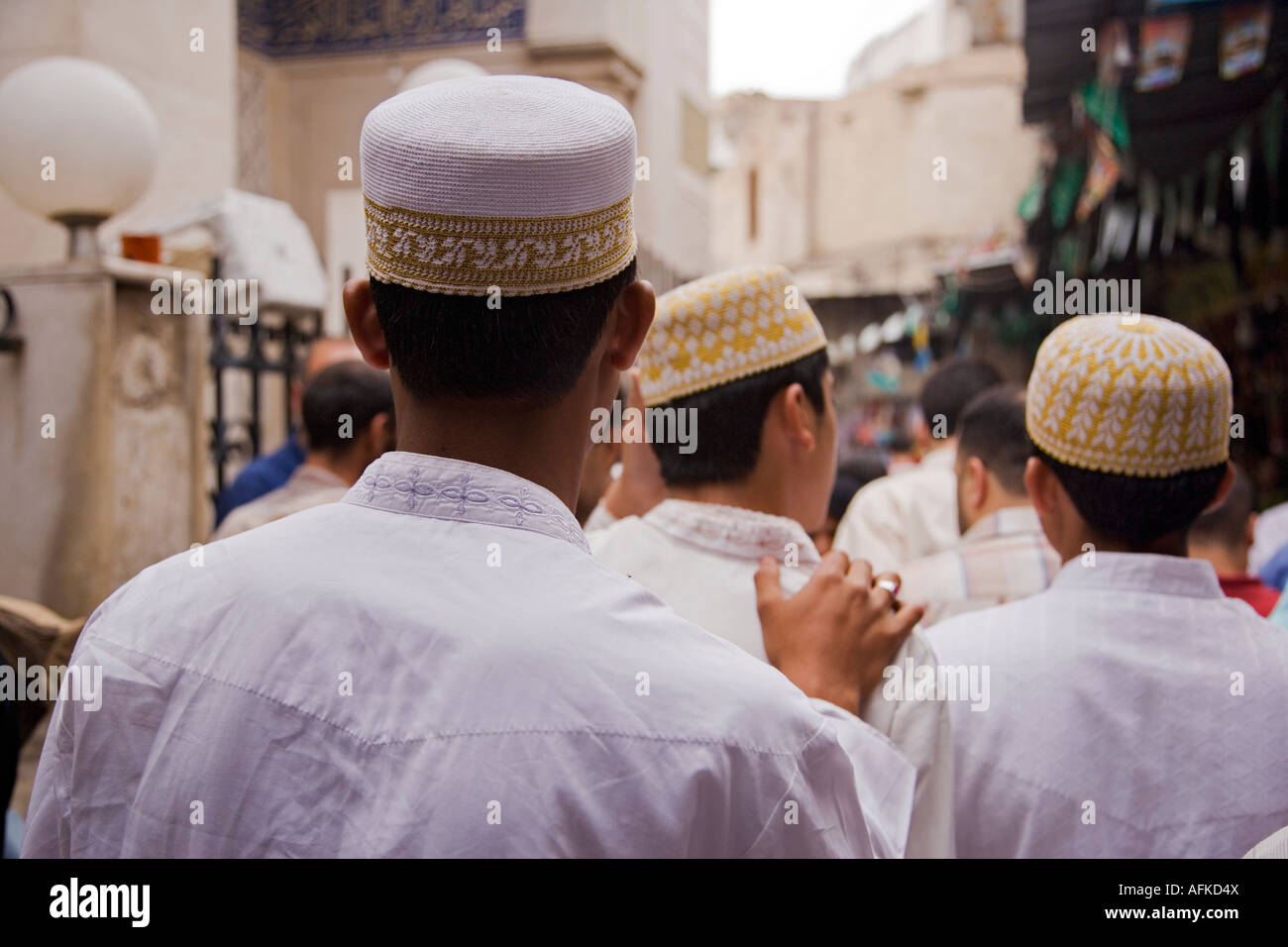 Boys make their way to the Sayyida Ruqayya Mosque in the Old City ...
