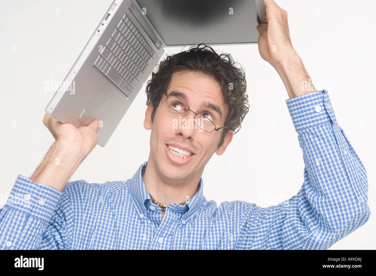 Man holding laptop Stock Photo - Alamy