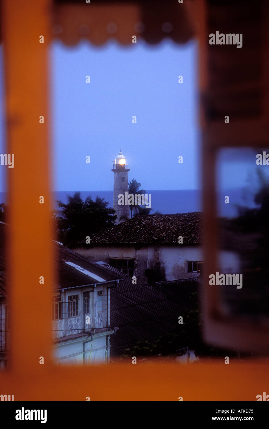 View out of hotel room window of the lighthouse in the port city of ...