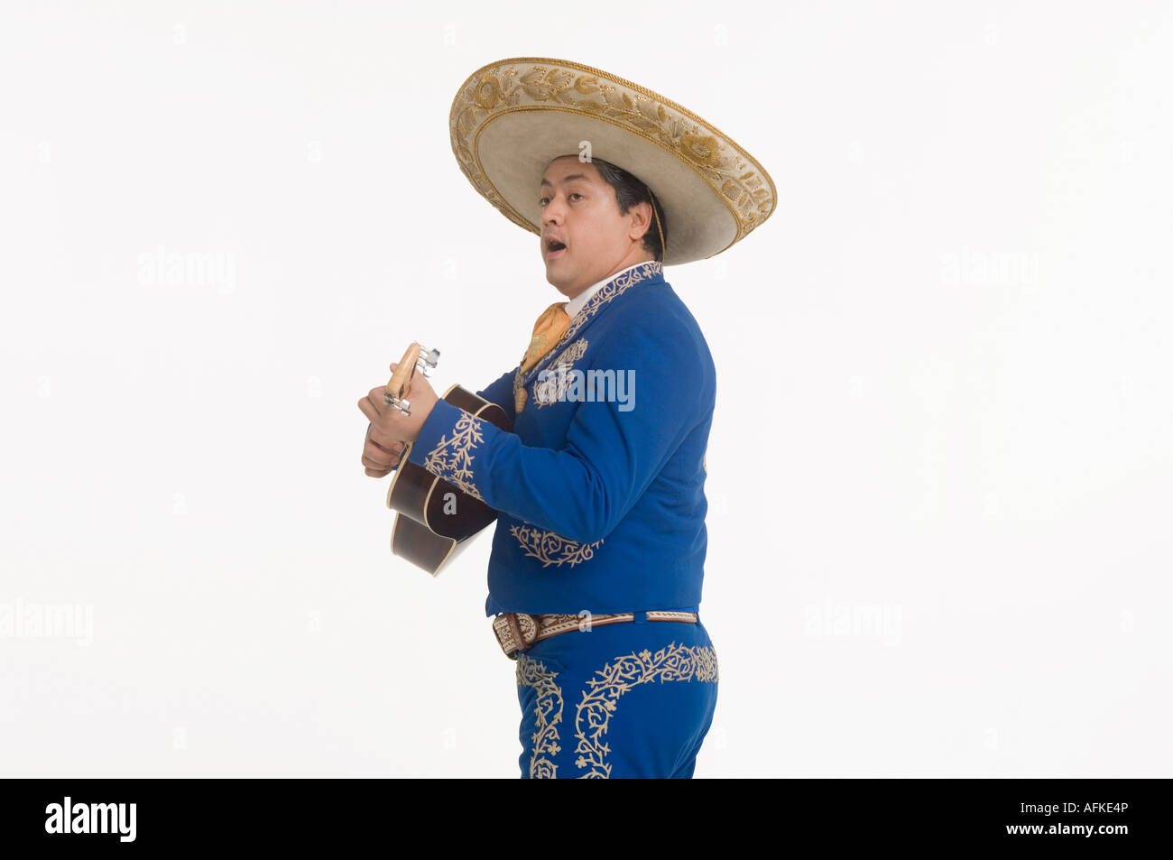 Portrait of Mariachi playing guitar and singing Stock Photo - Alamy