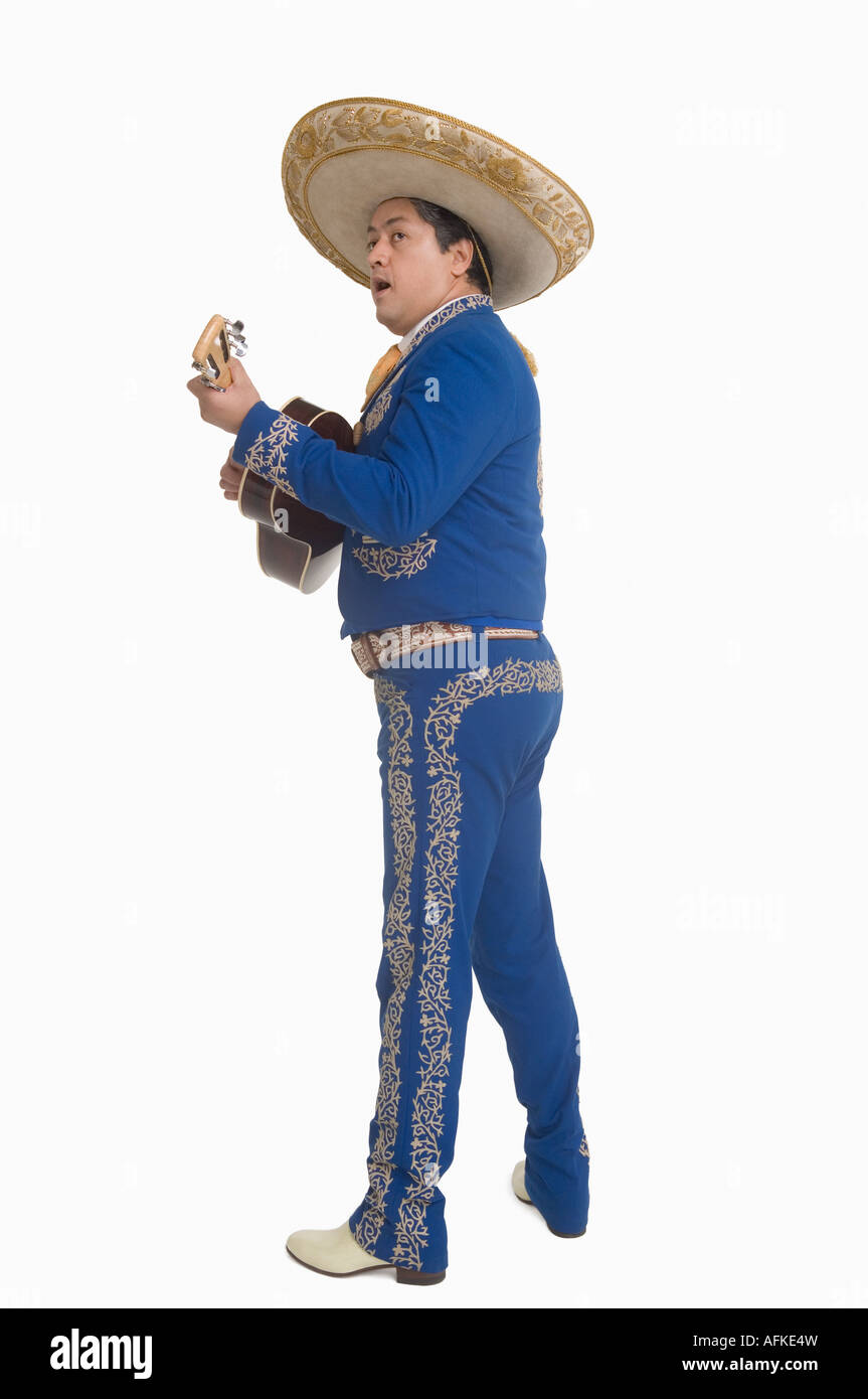 Portrait of Mariachi playing guitar and singing Stock Photo - Alamy
