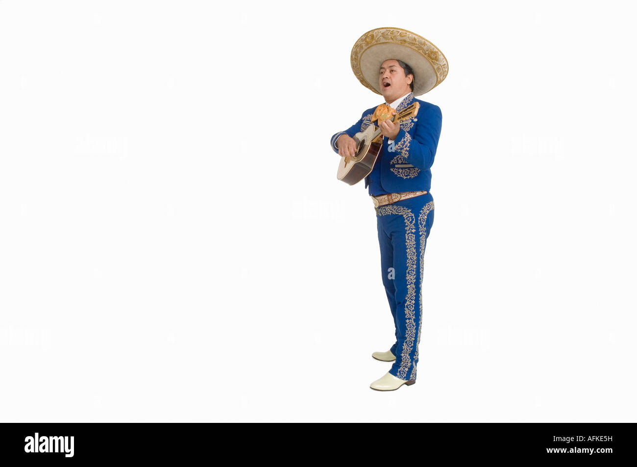 Portrait of Mariachi playing guitar and singing Stock Photo - Alamy