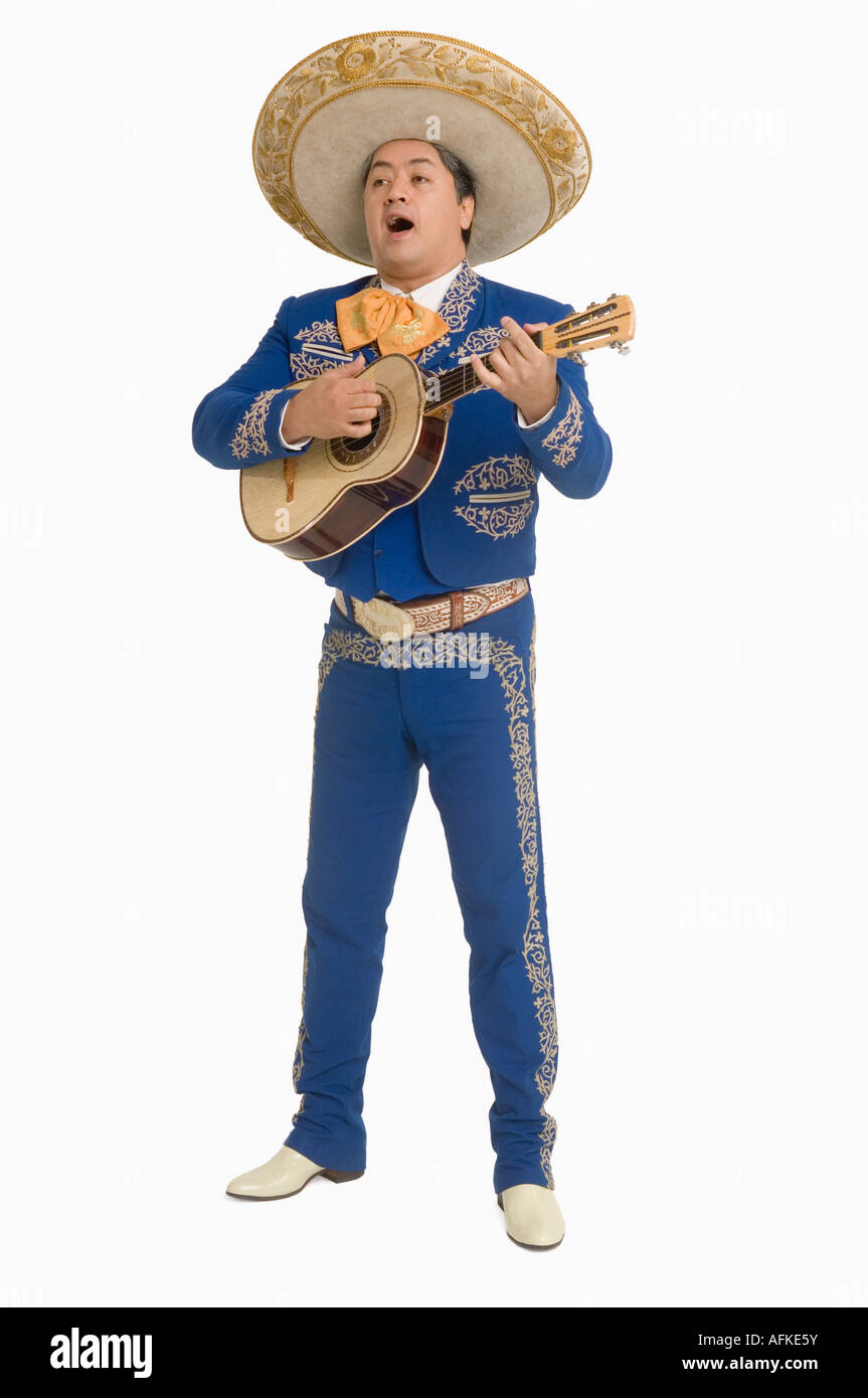 Portrait of Mariachi playing guitar and singing Stock Photo - Alamy