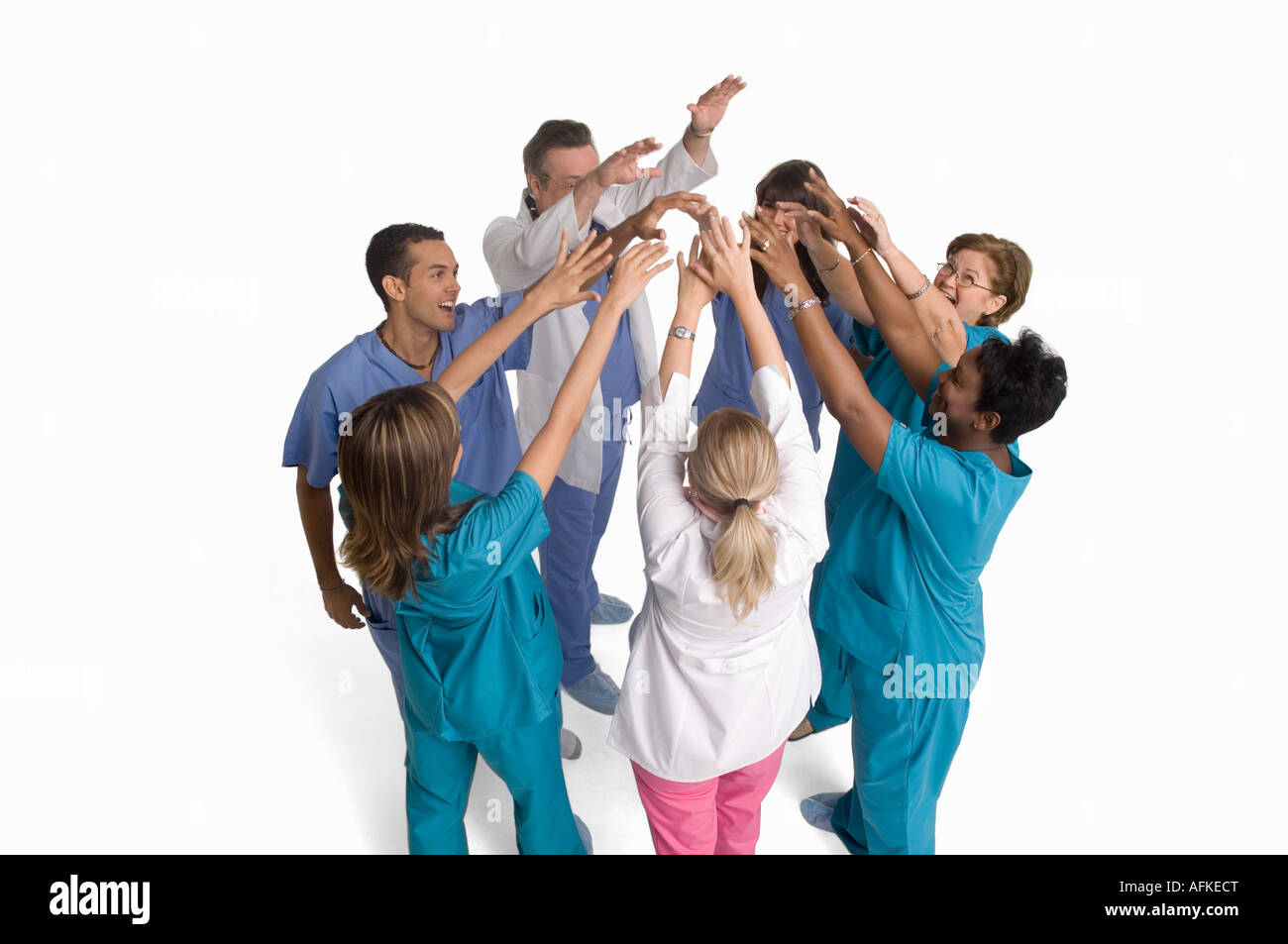 Group portrait of nurses and doctors cheering in circle Stock Photo - Alamy