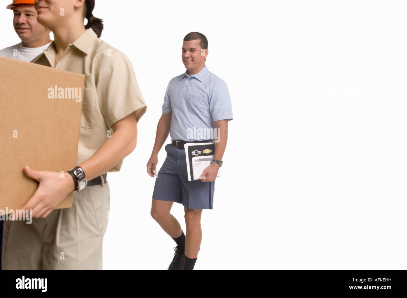 Postal worker, delivery man and construction worker walking Stock Photo ...