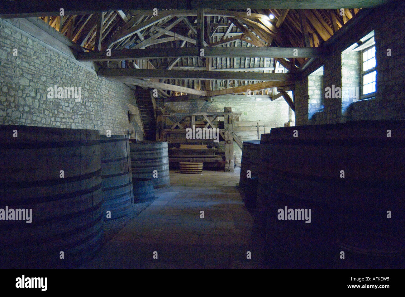 Large medieval wine vats at Chateau Clos de Vougeot in Burgundy, France ...