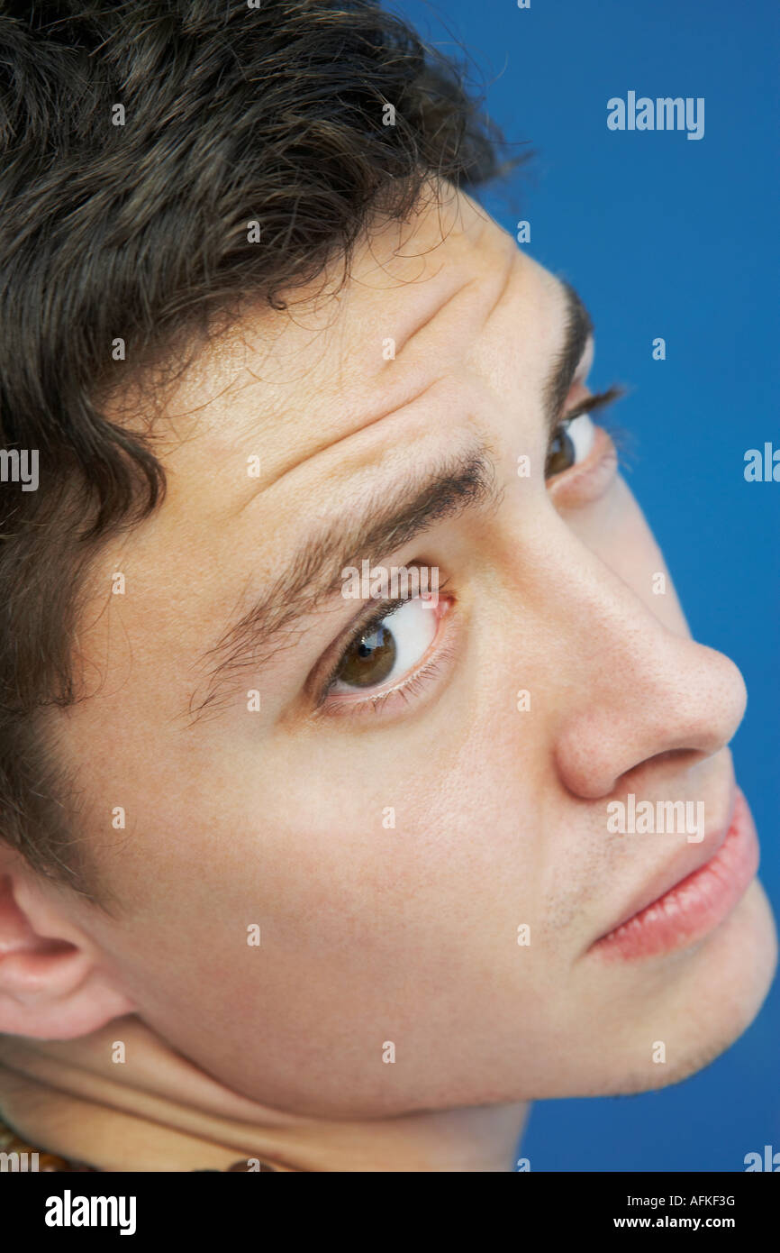 Young man looking back Stock Photo - Alamy