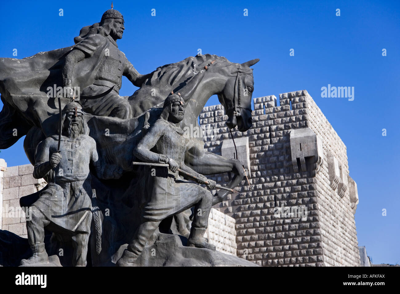 A statue of Saladin stands in front of the citadel, Damascus, Syria ...