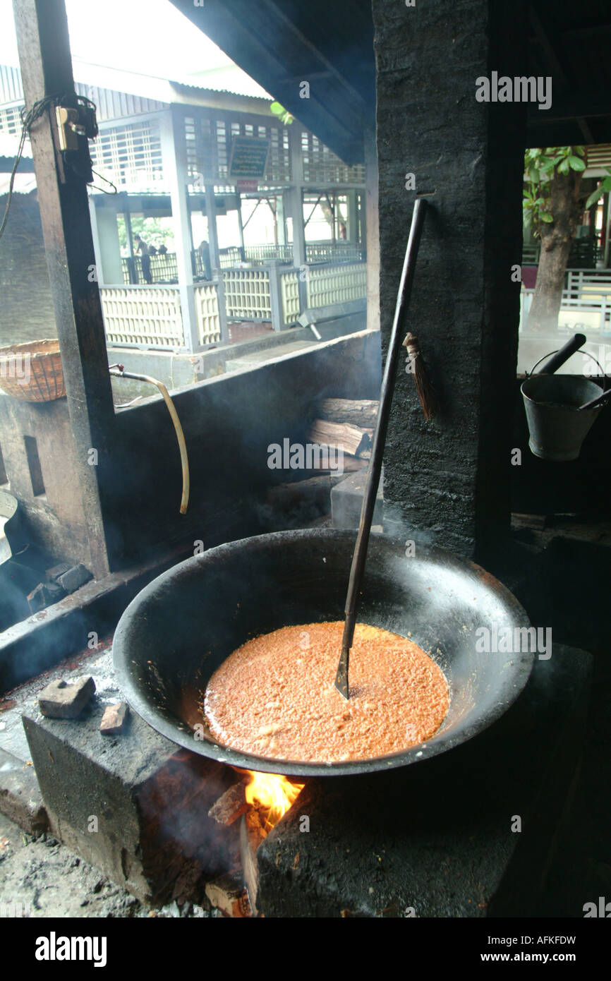 Sauce cooking on a stove in the Mahagandayon Buddhist monastery in ...