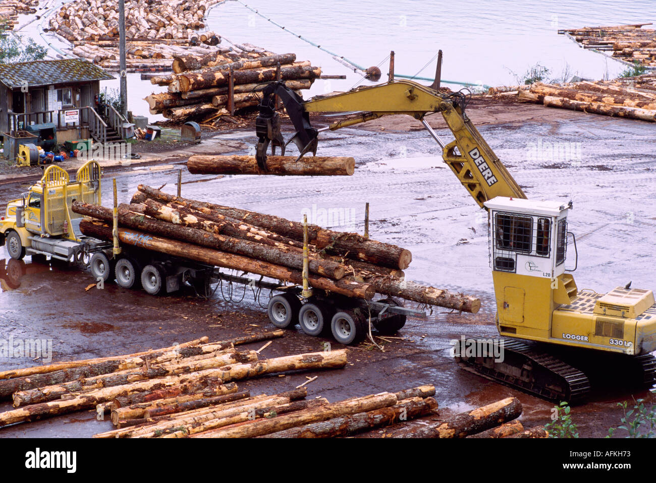 A Log Picker unloading Logs at a Log Yard at Beaver Cove on Vancouver ...
