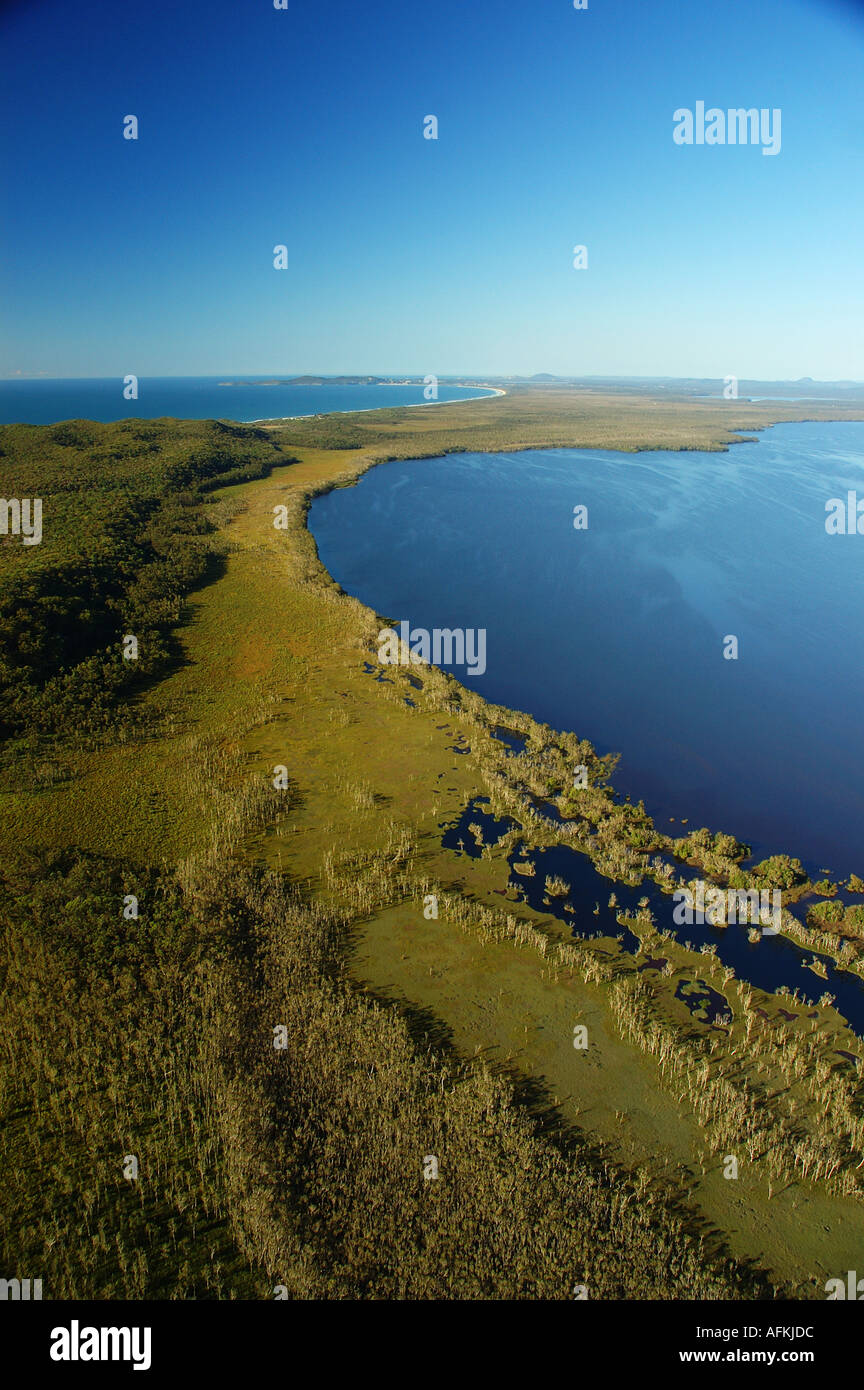 Floating lake with tree covered sand dune Noosa National park ...