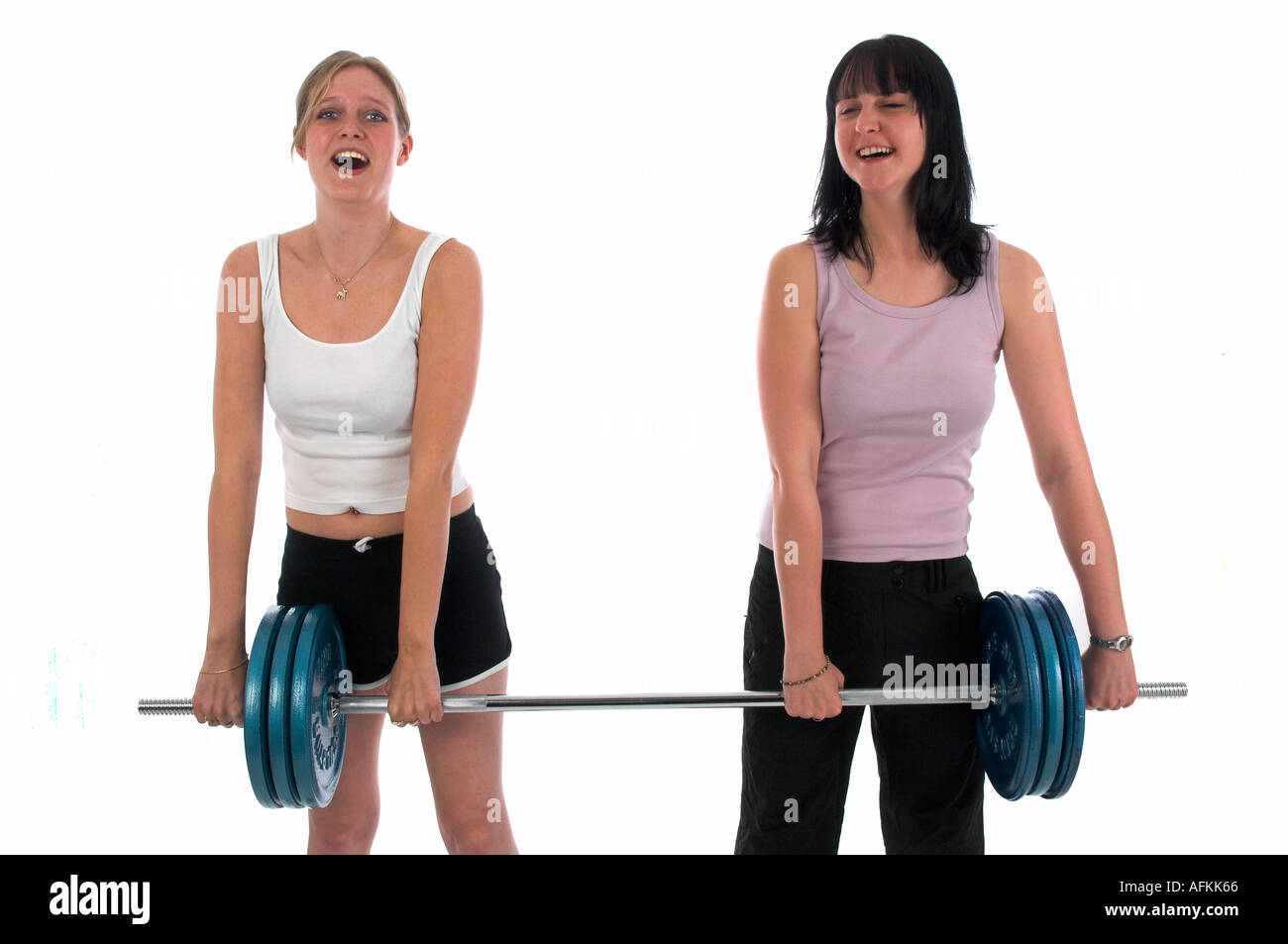 Two young women Barbell exercise together Stock Photo - Alamy