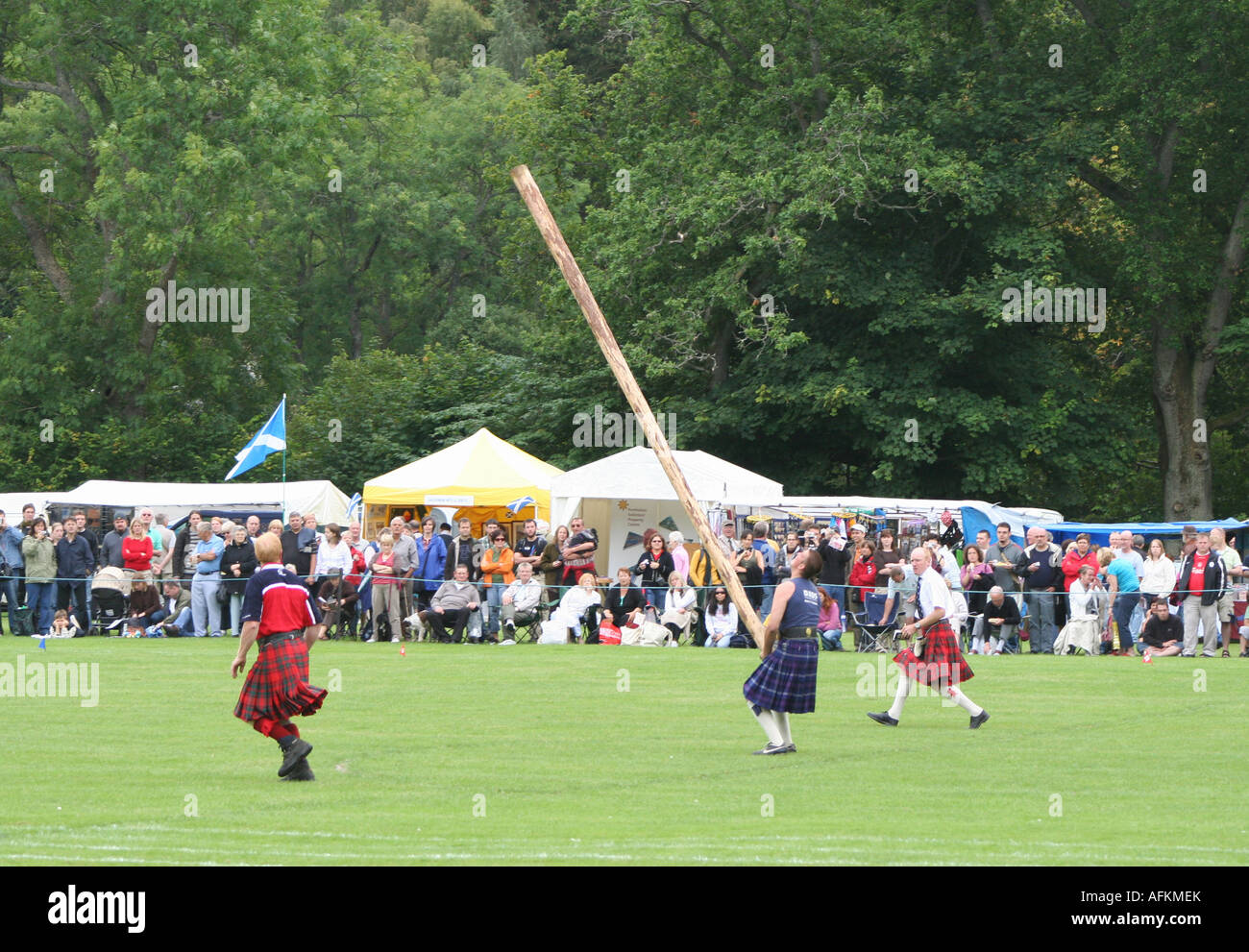Scottish man in kilt tossing the caber at highland games Pitlochry ...