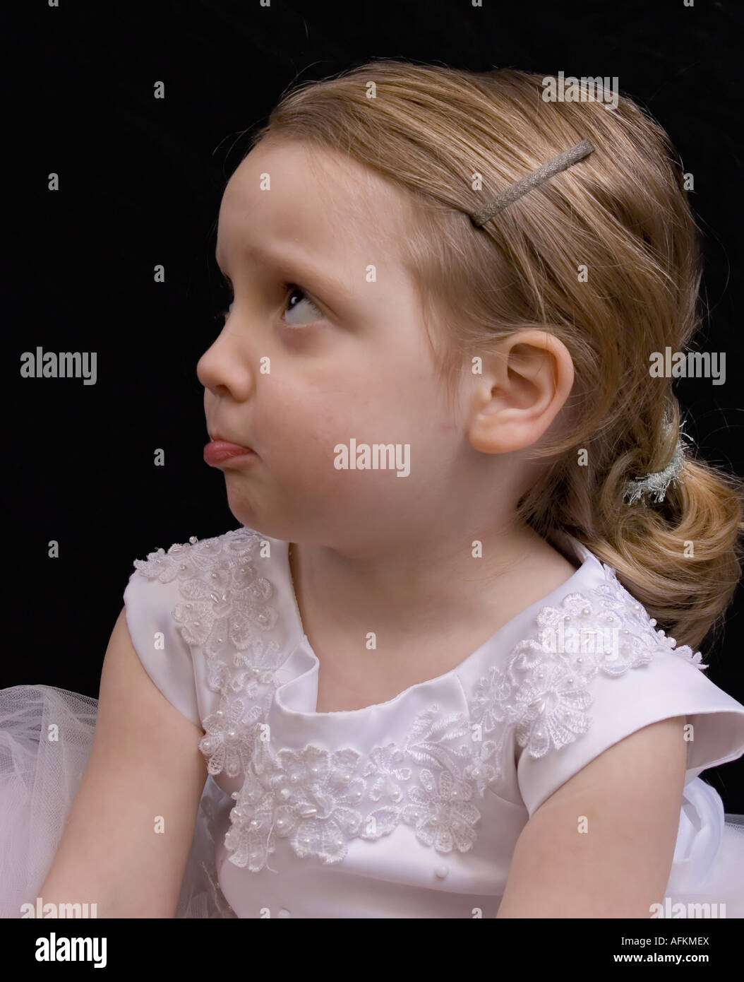Angry little girl sticking out her lip as she pouts Stock Photo - Alamy