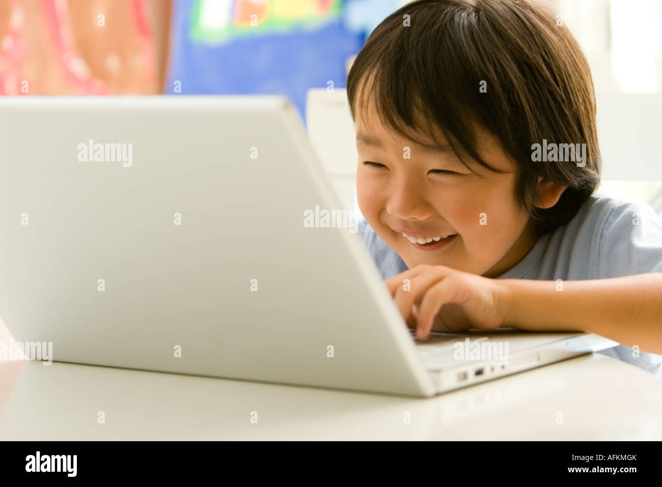 Young Boy on Computer Stock Photo - Alamy