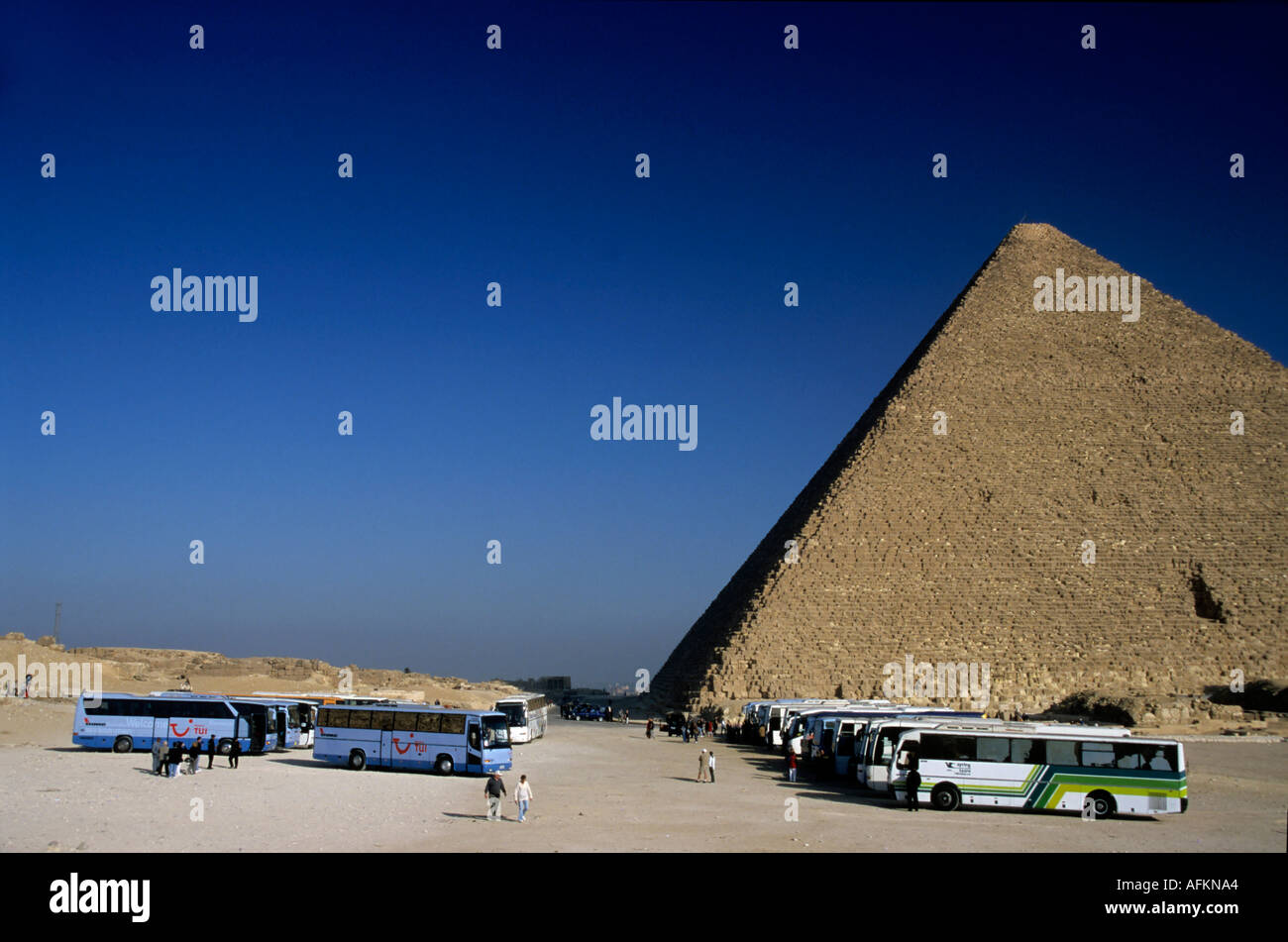 Tourists at the Pyramids, Giza, Egypt - Buses parked at the foot of the ...