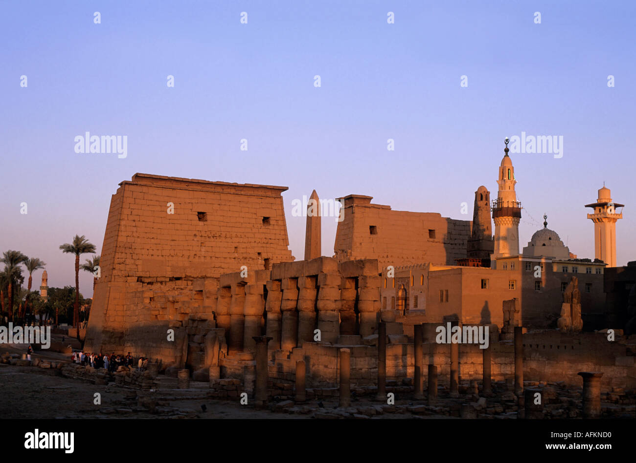 Tourists visiting the Luxor Temple at sunset, Luxor, Egypt Stock Photo ...