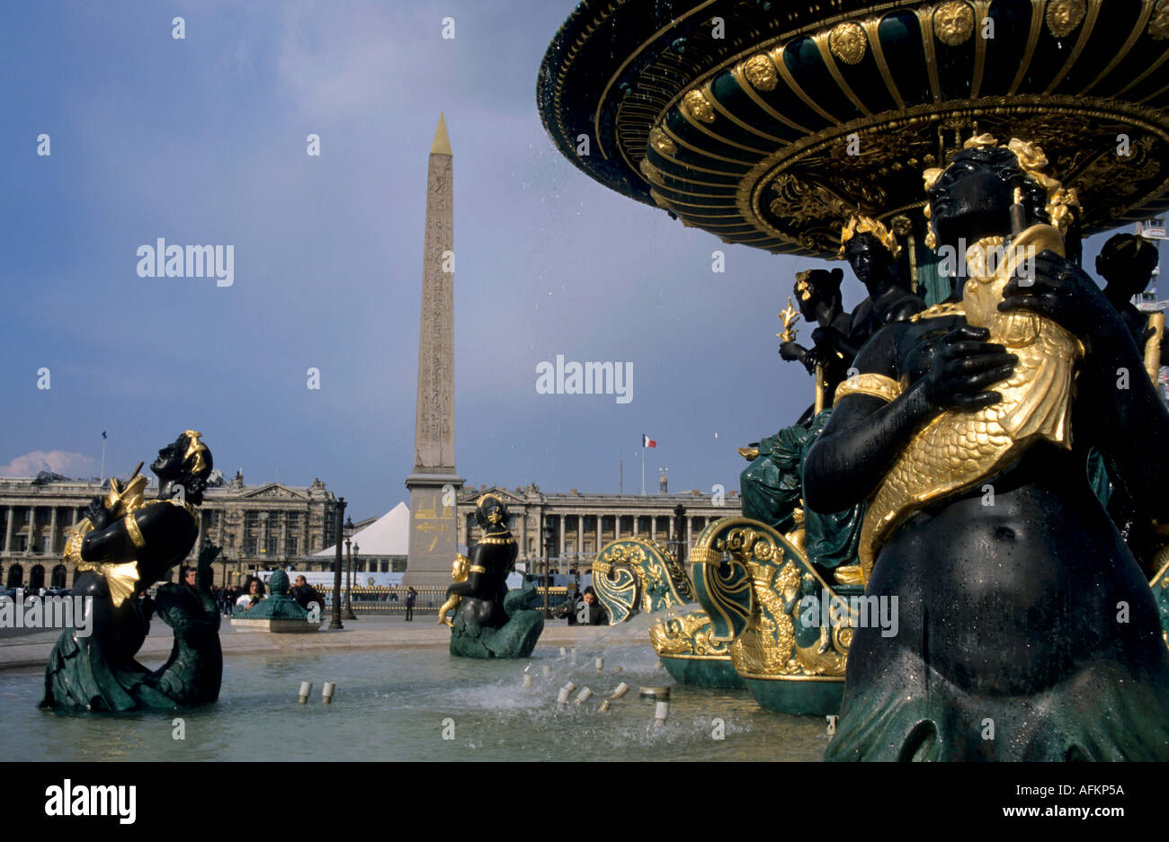 Water fountain and obelisk on the Place de la Concorde, Paris, France ...