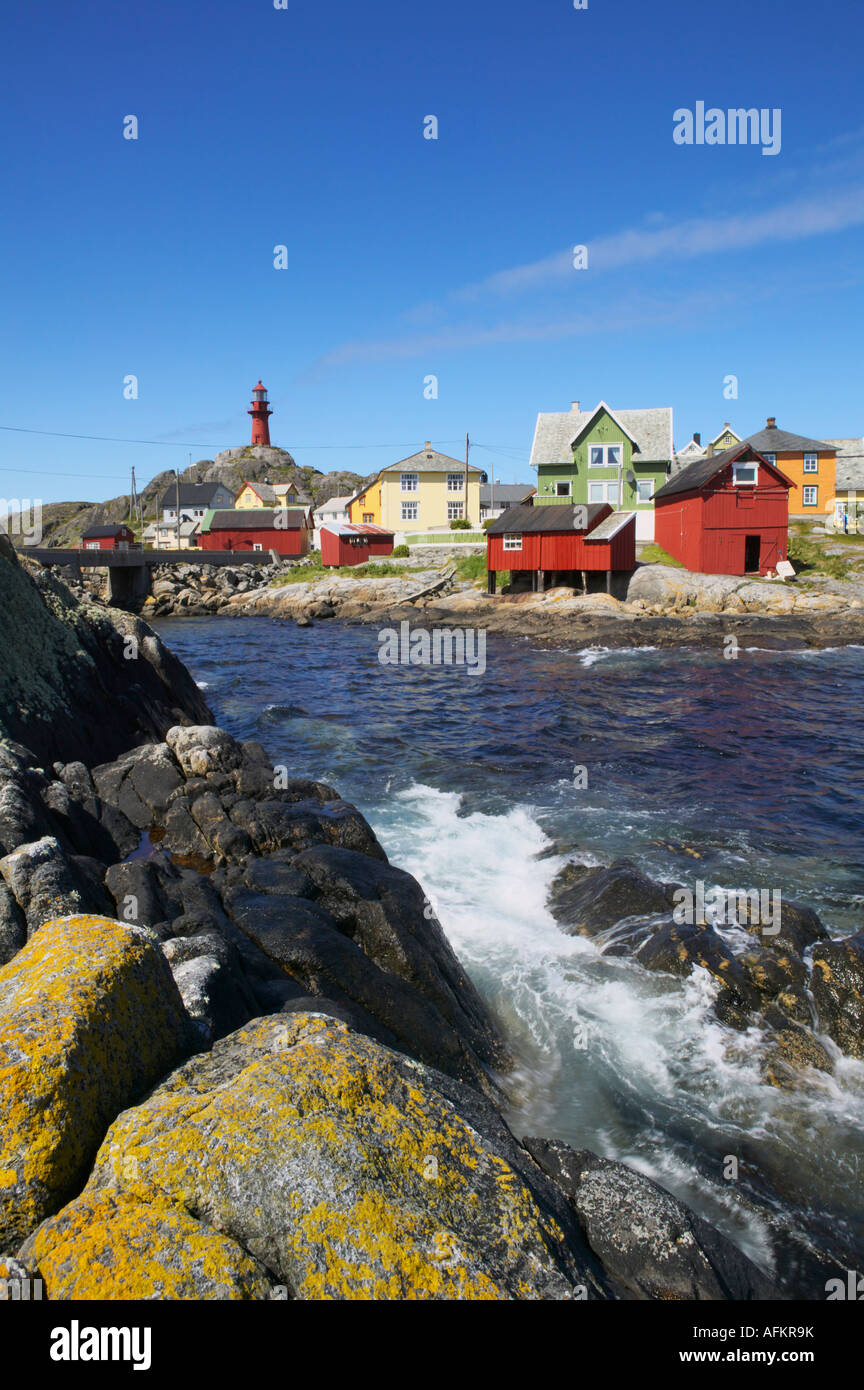 The Ona lighthouse on Onakalven above the fishing village of Ona Sandoy ...