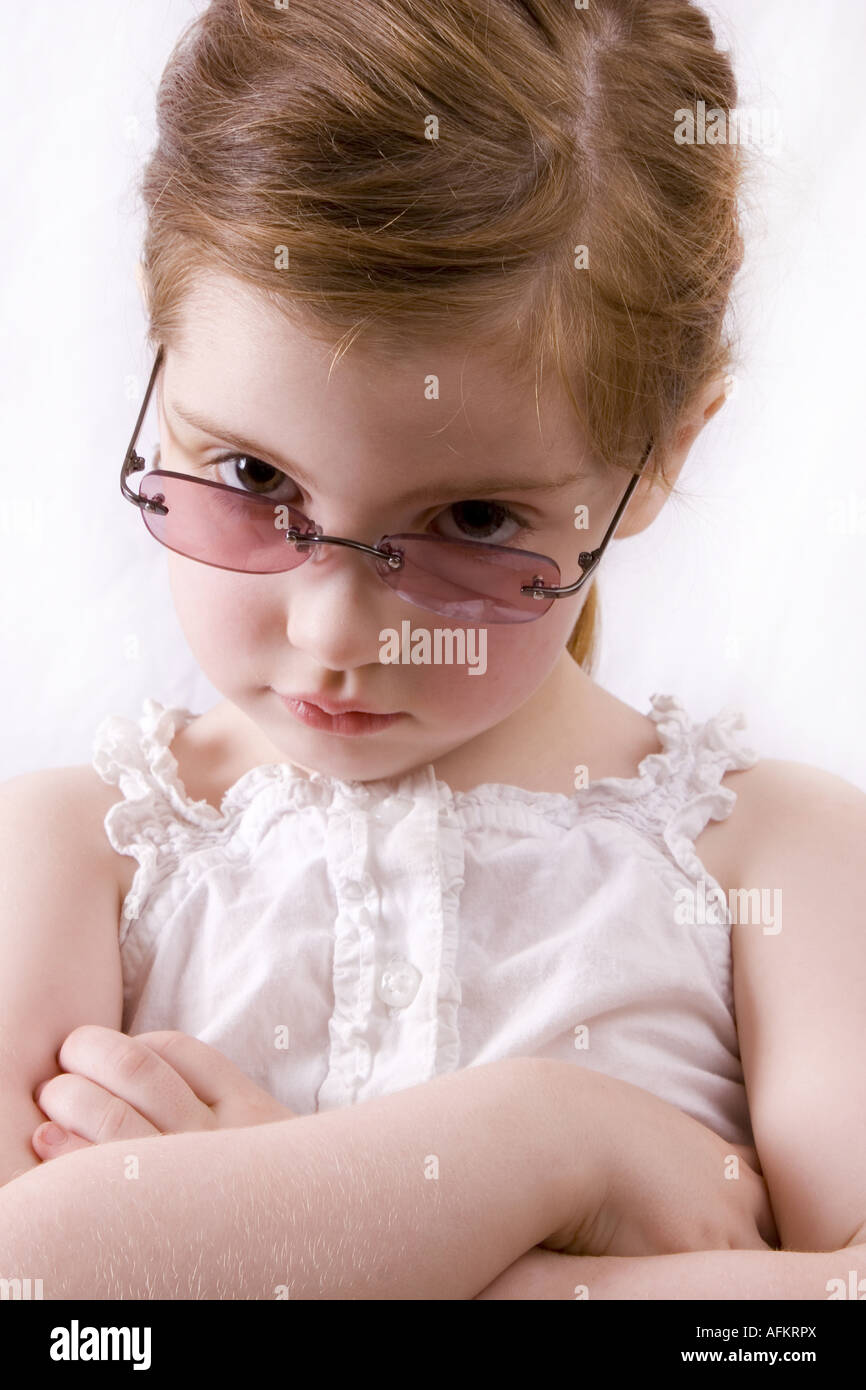 Serious little preschooler in a high key portrait Stock Photo - Alamy