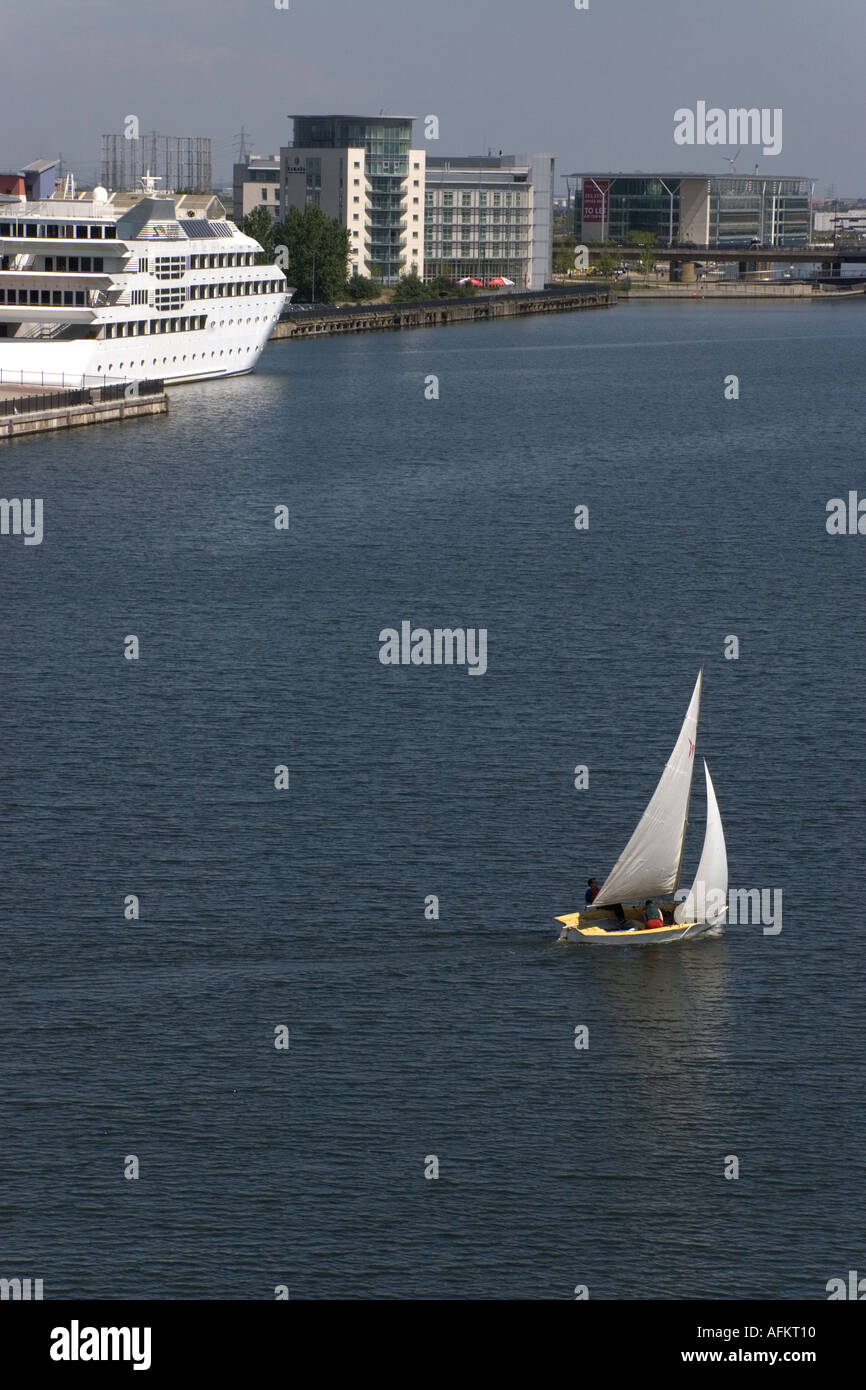 small dinghy sailing upwind with two crew in Royal Victoria Docks ...