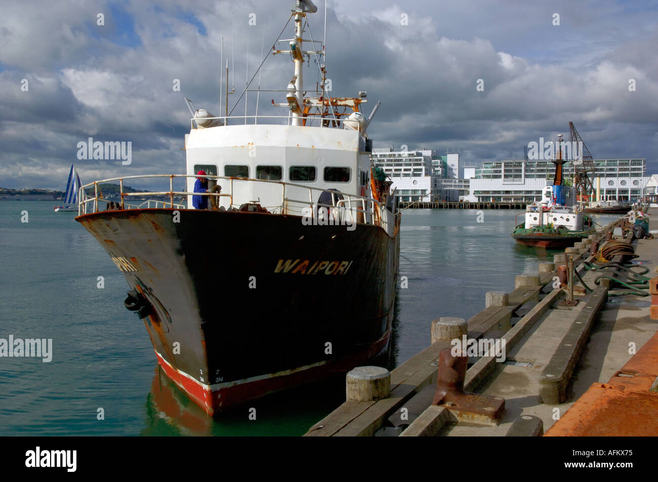 Fishing trawler leaving jetty downtown marina Viaduct harbour Auckland ...